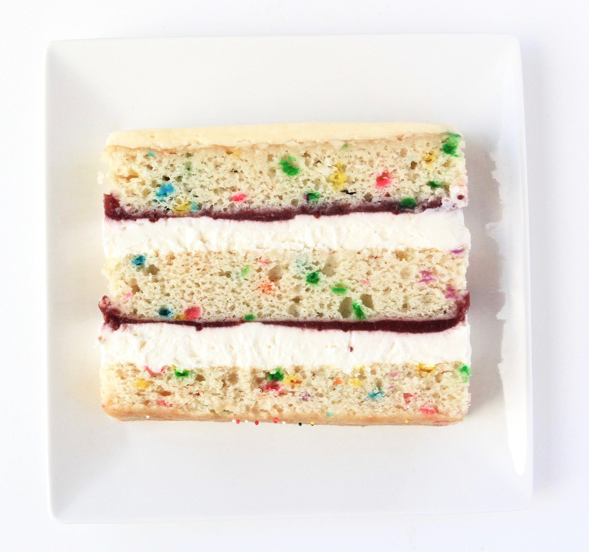 Huge Fresh Baked Cake Slice by Sift Dessert Bar · Sift Dessert Bar